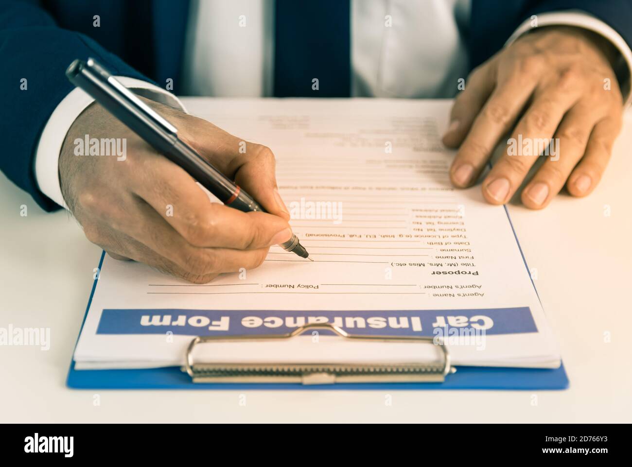 Insurance Agent Hand Writing Car Insurance Claim Form or Insurance ...