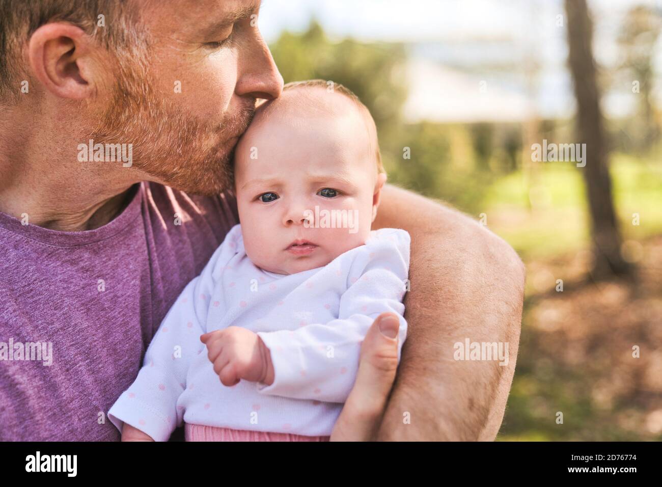 Beautiful father And Baby outdoors. Dad and her Child playing together ...