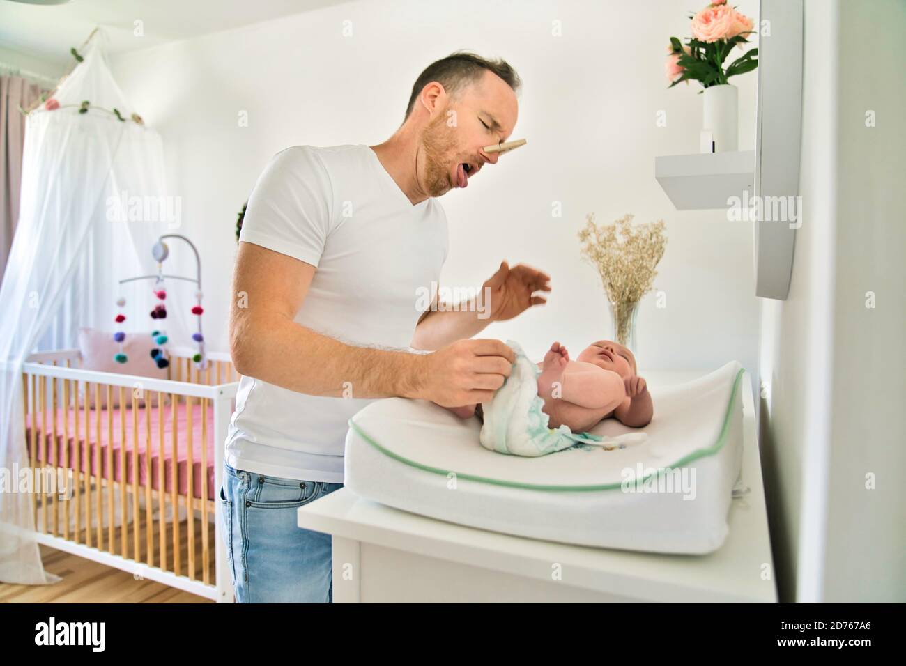 A Father Changing Baby's Diaper In nursery Stock Photo - Alamy