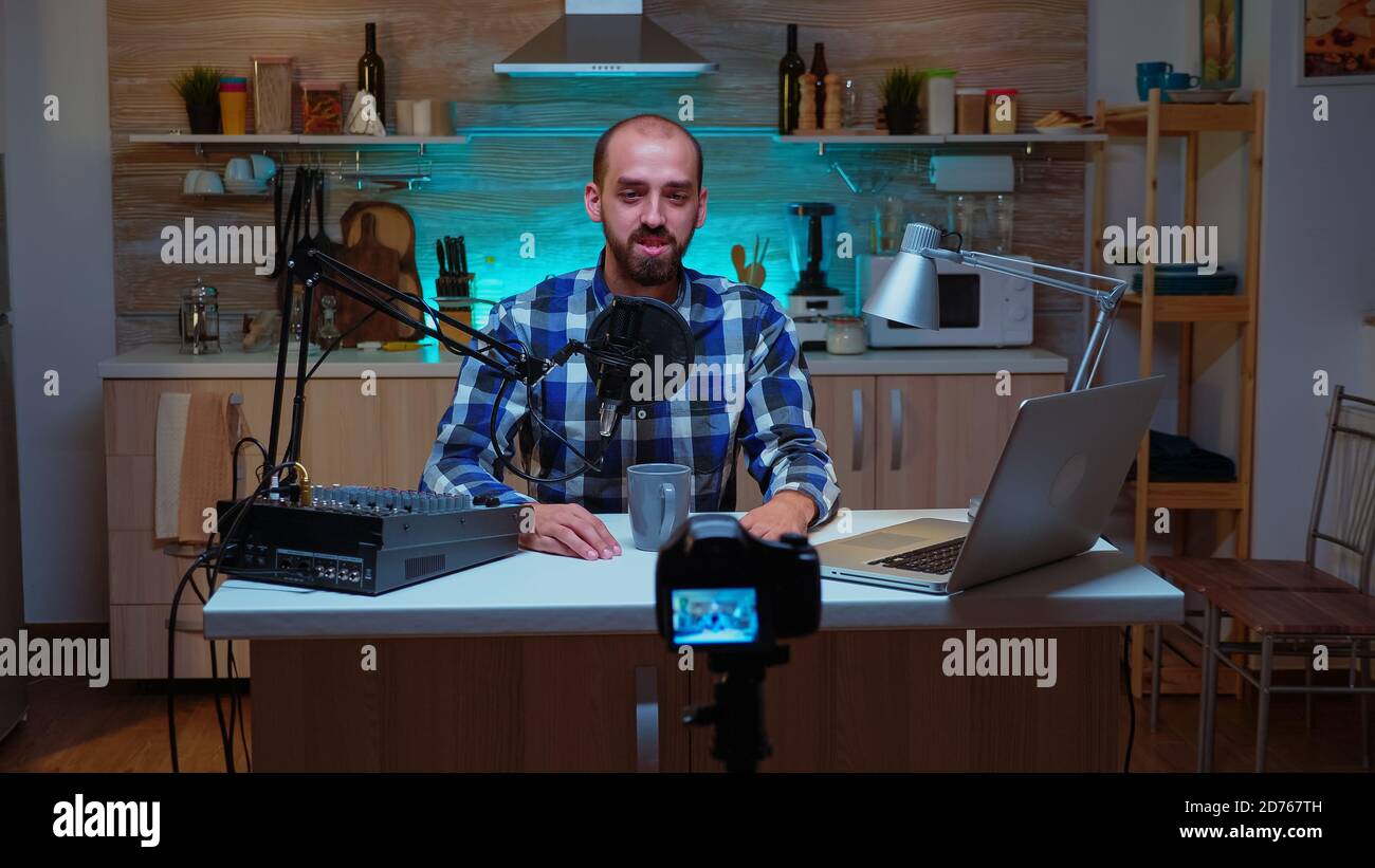 Famous blogger in home studio broadcasting using modern technology ...