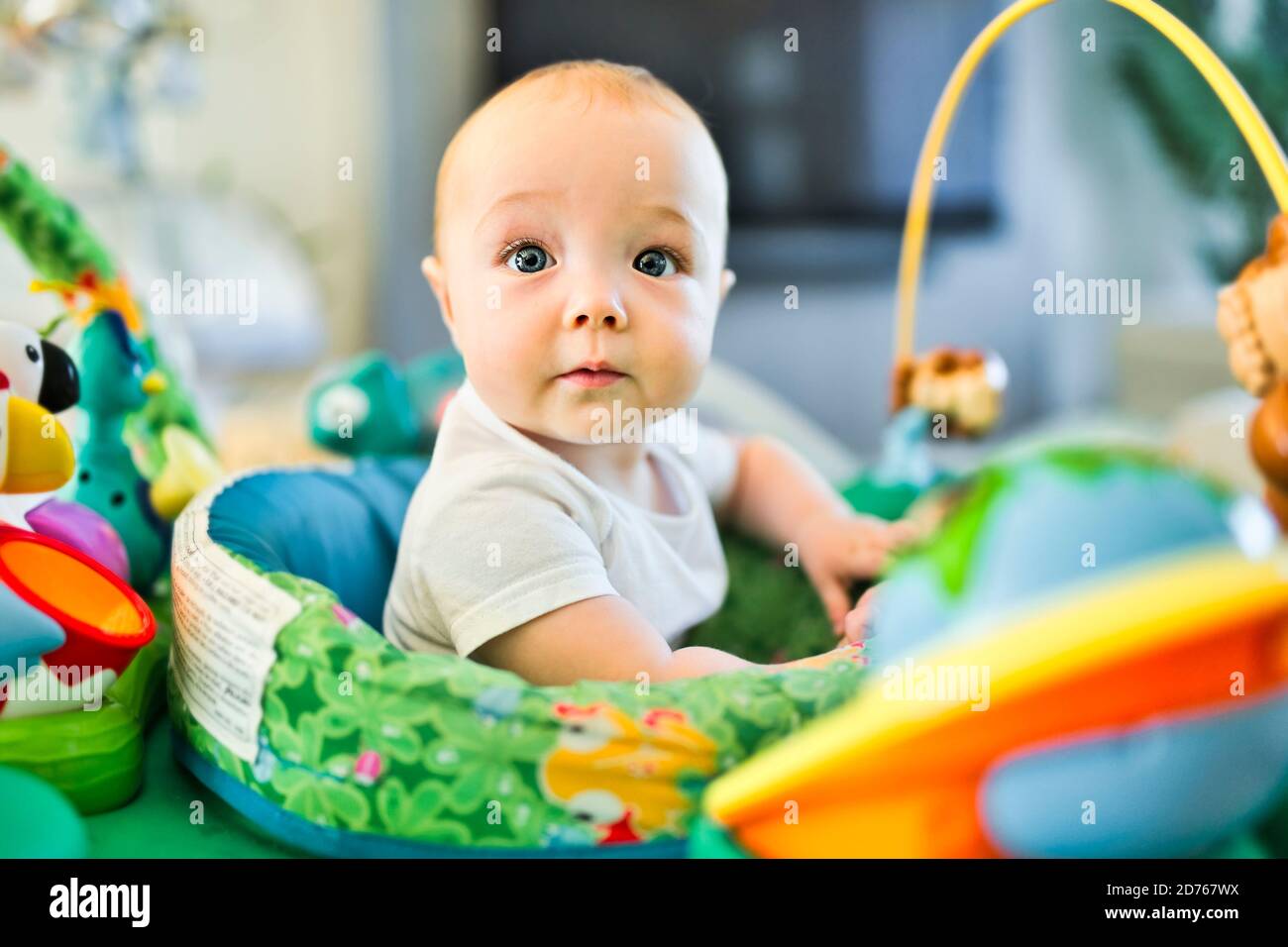 little baby playing with toys at home in the living room Stock Photo ...