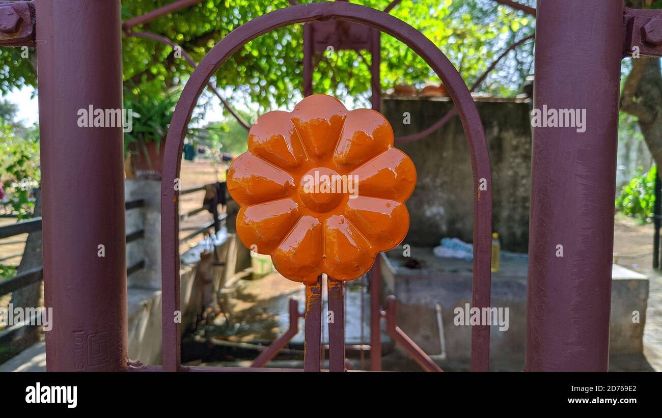Beautiful abstract design of orange color on a new iron gate Stock ...
