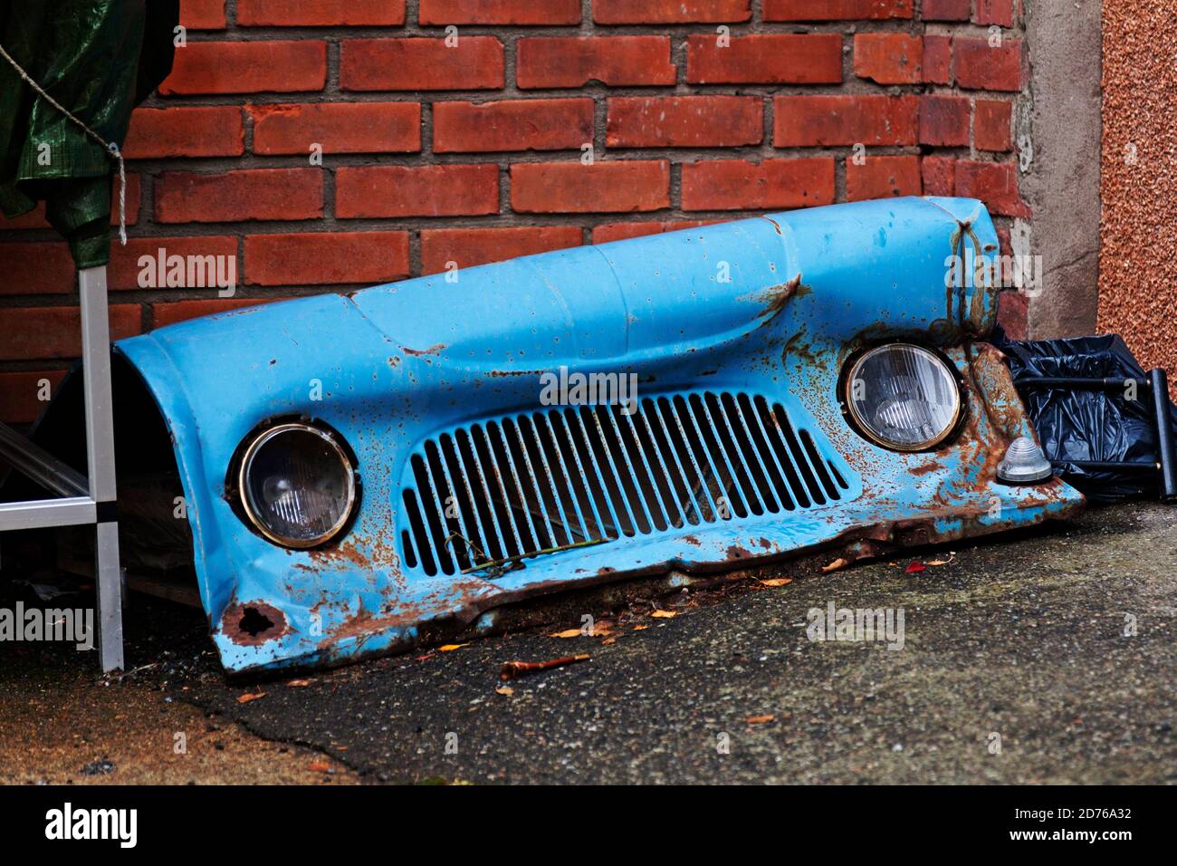 part of broken blue car front fender Stock Photo - Alamy