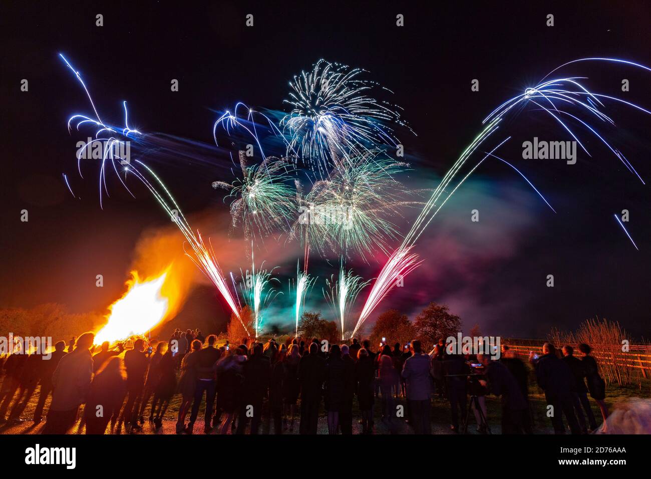 Spectacular and colourful firework display set against a dark Autumn ...