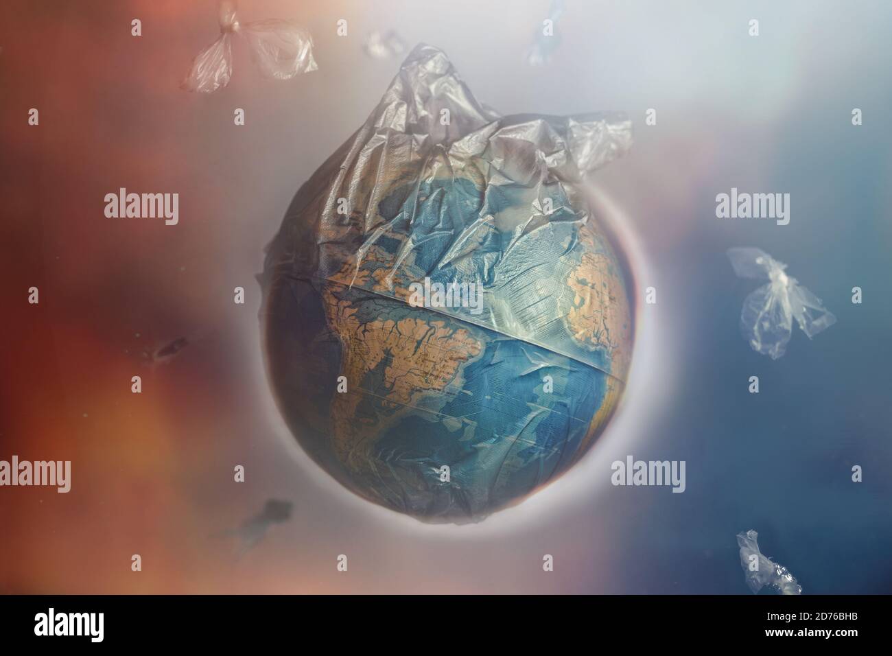 Globe of planet Earth dressed in a garbage plastic bag. Fly around the ...