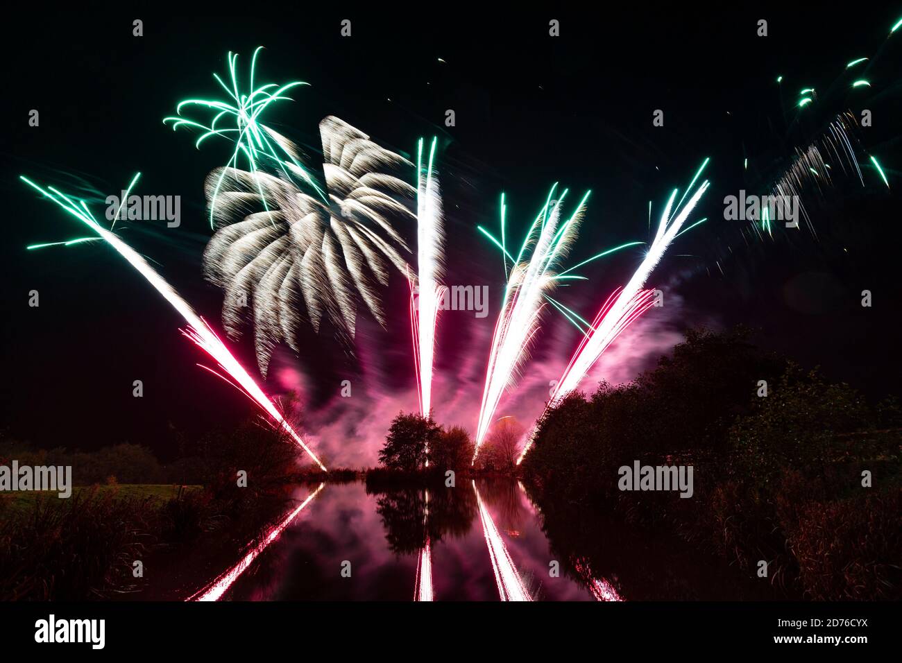 Spectacular and colourful firework display set against a dark Autumn ...