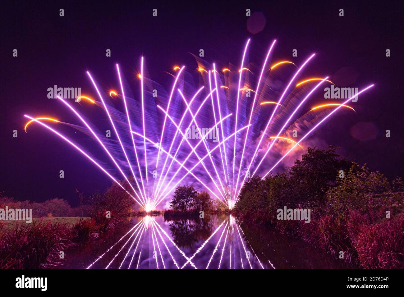 Spectacular and colourful firework display set against a dark Autumn ...