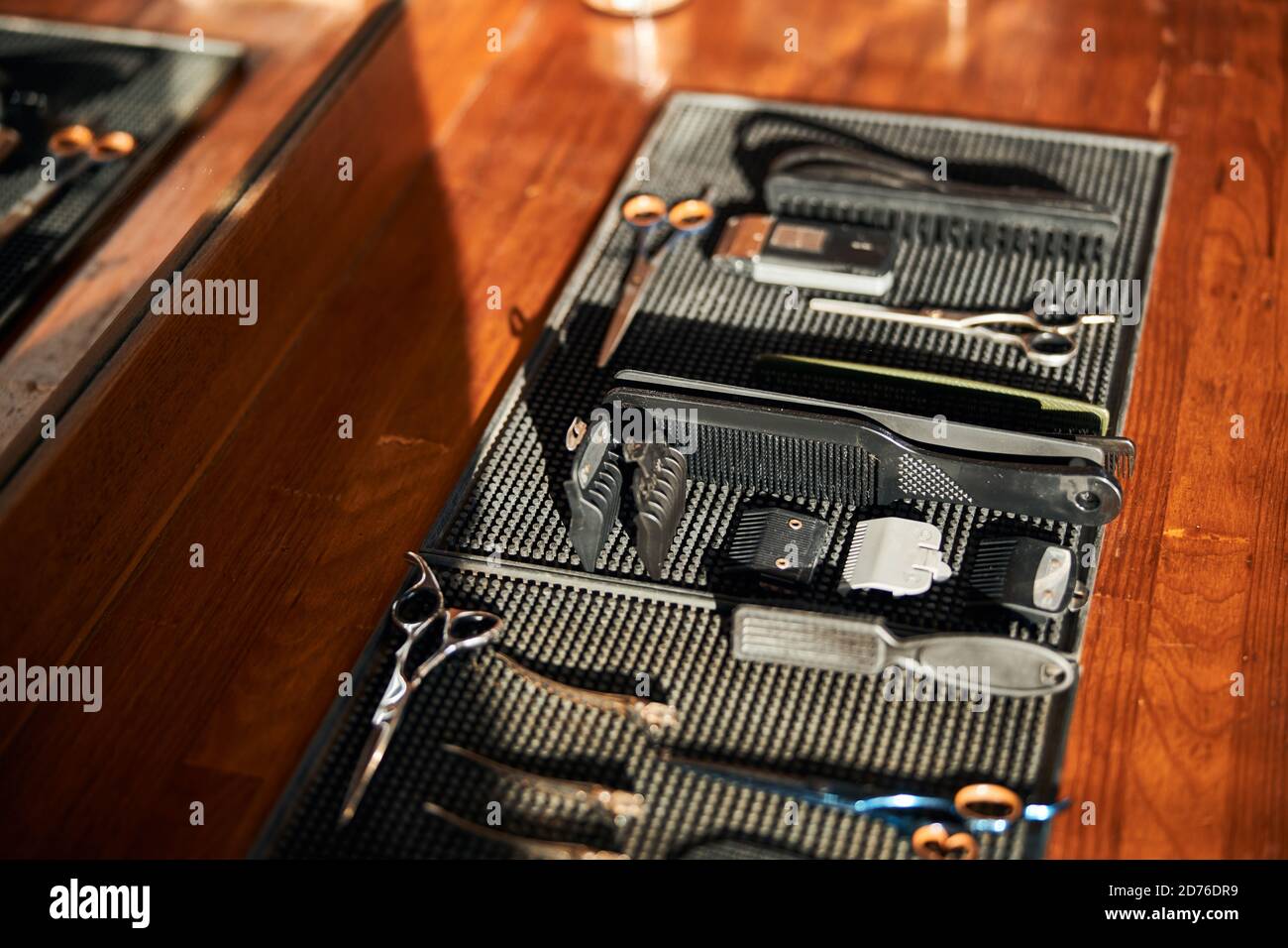 Collection of barber tools on black rubber mat Stock Photo - Alamy
