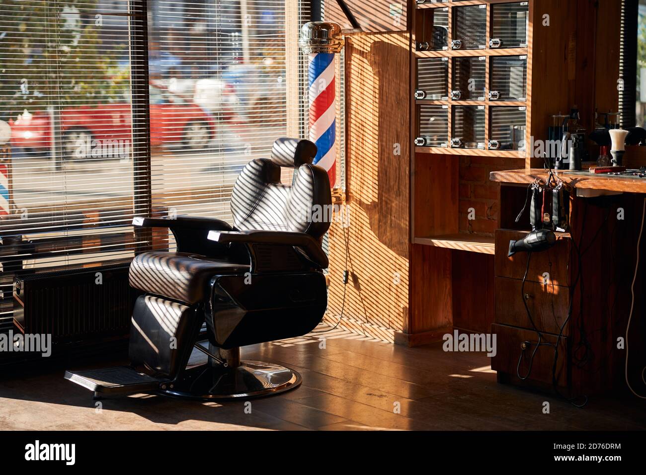 Interior of barbershop with barber chair and hairdressing tools Stock ...