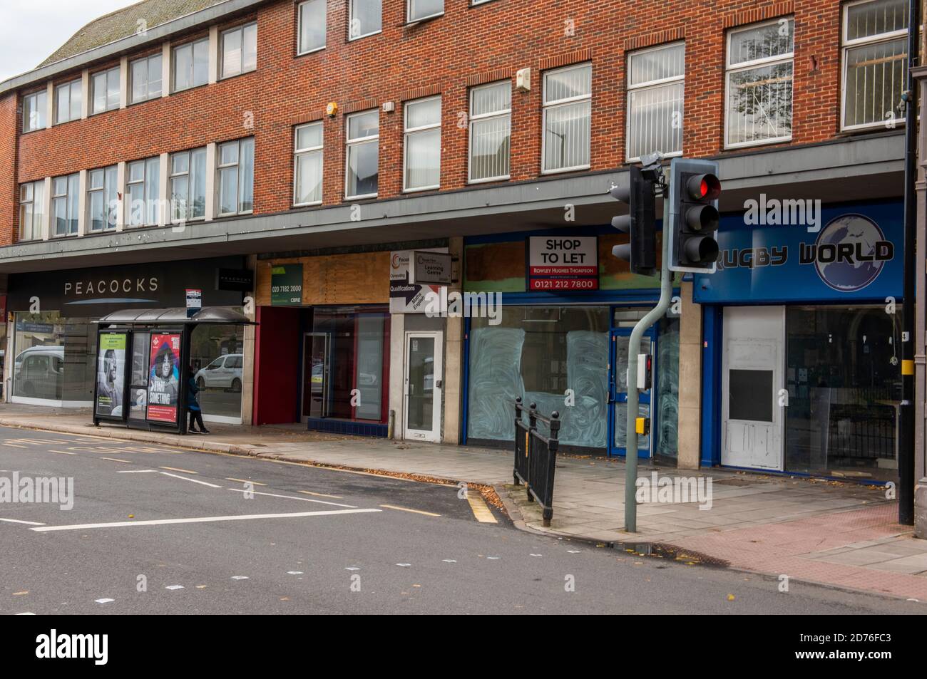an empty high street deserted shops closed down during the corona virus ...