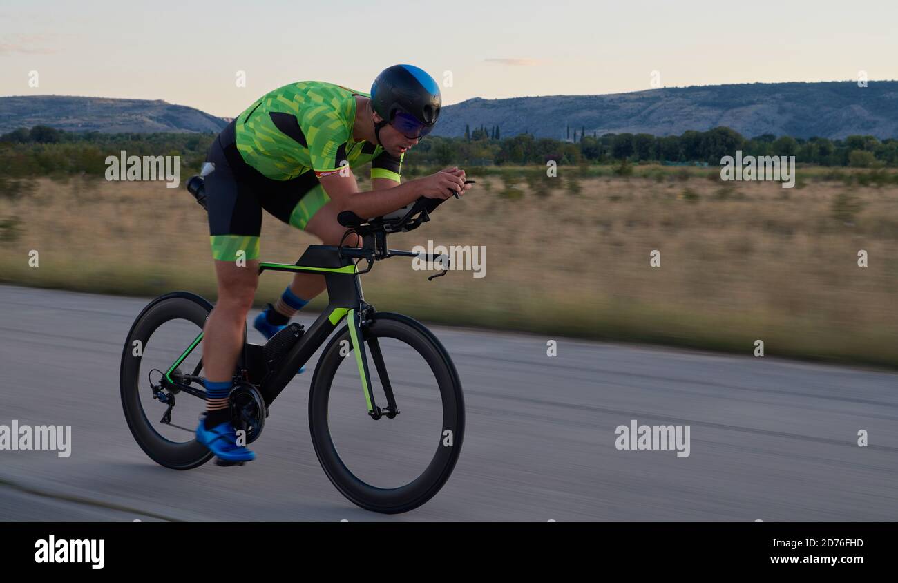triathlon athlete riding a bike Stock Photo - Alamy