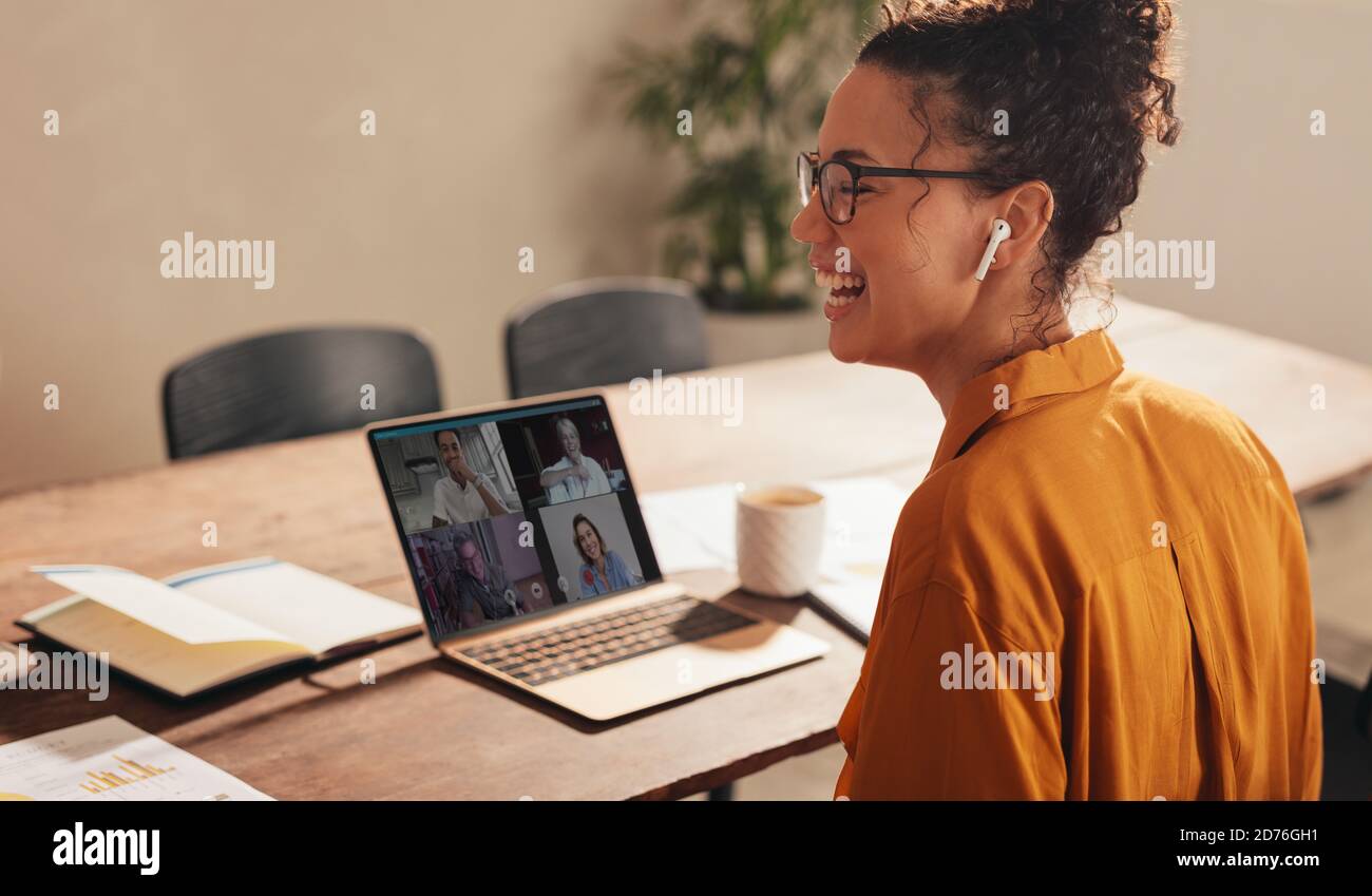 Laughing at a zoom call meeting hi-res stock photography and images - Alamy