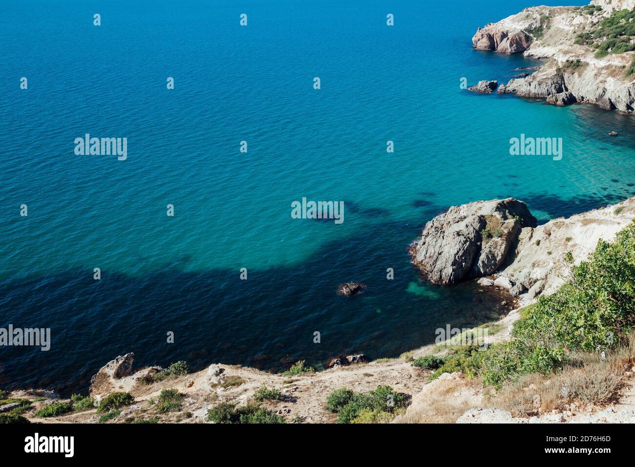 blue sea rocks and stones at the bottom Stock Photo - Alamy