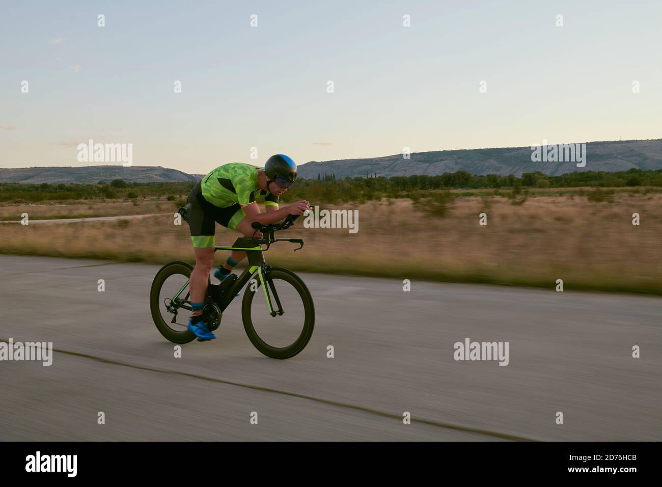triathlon athlete riding a bike Stock Photo - Alamy