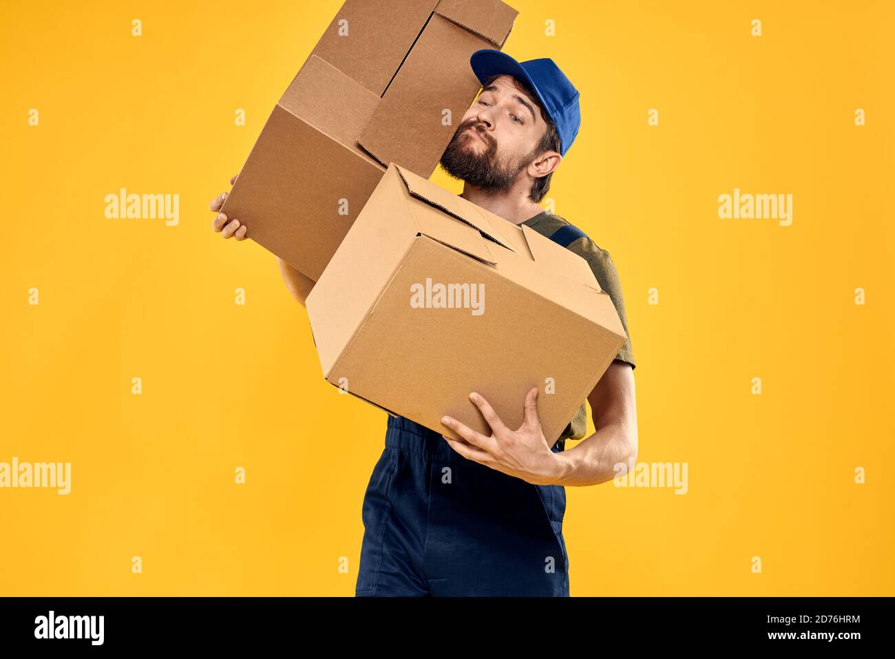 working man with box in hands delivery loading transportation service ...