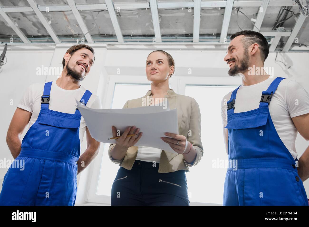 Customer discusses with the builder the details of building a house ...