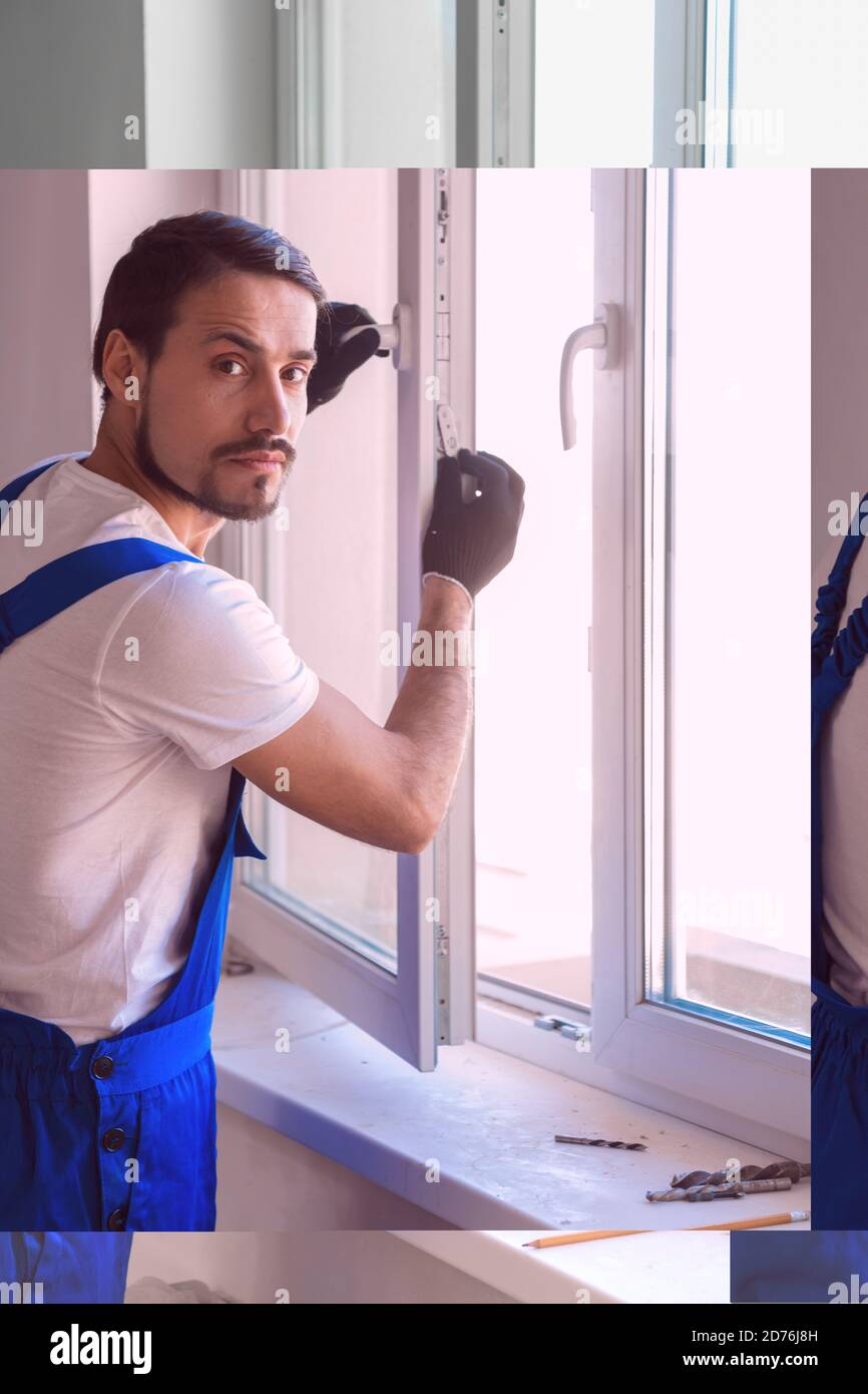 Man in blue uniform preparing to install a window Stock Photo - Alamy