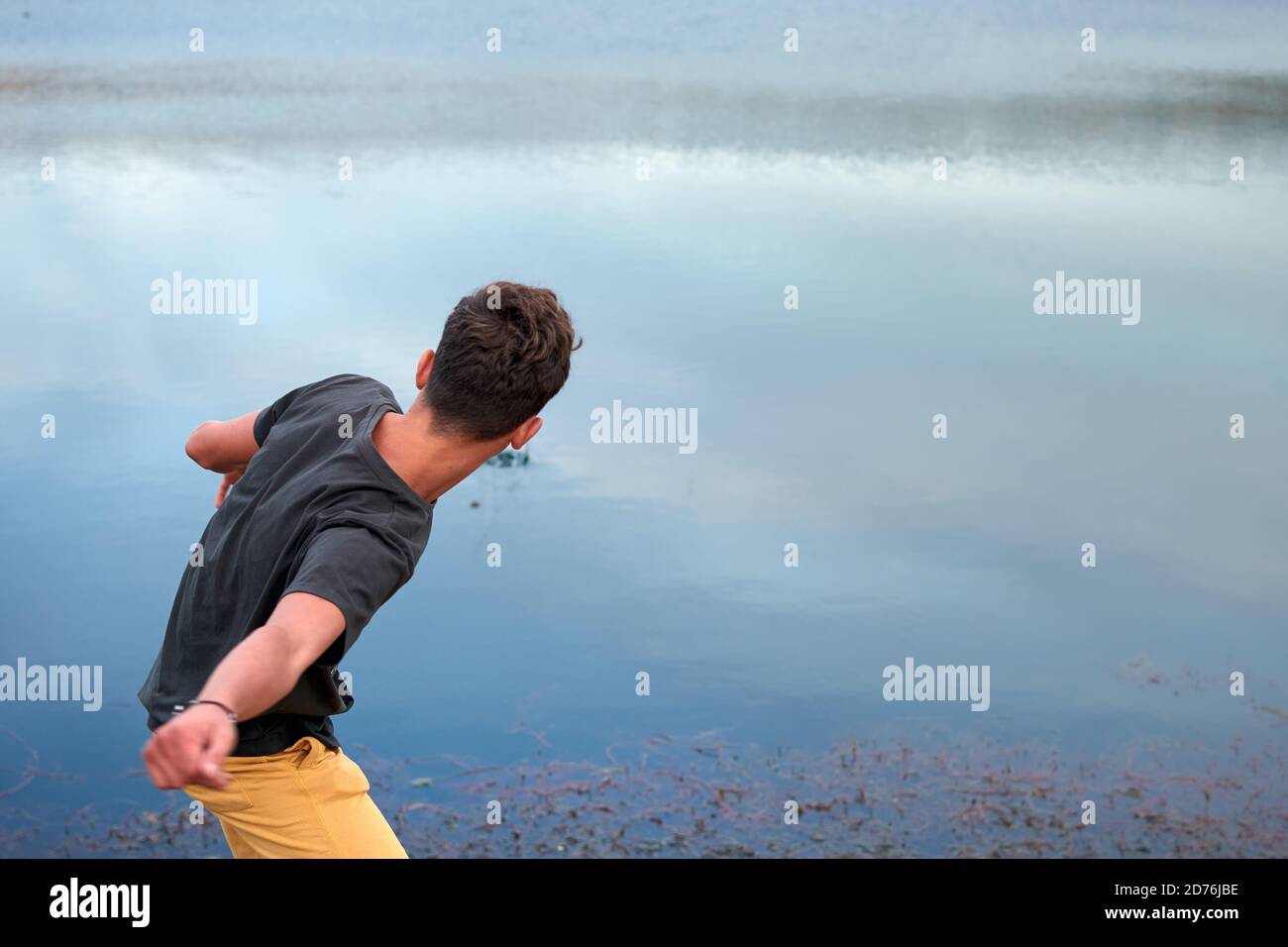 Man throwing stones hi-res stock photography and images - Alamy
