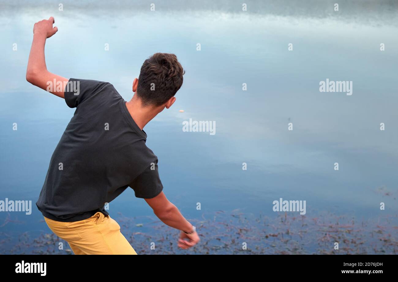 Man throwing stones hi-res stock photography and images - Alamy