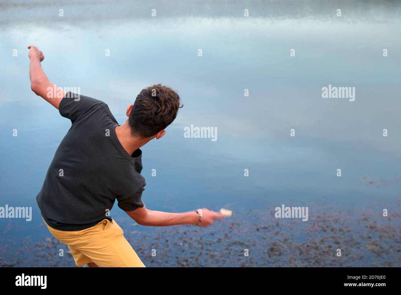 Man throwing stones hi-res stock photography and images - Alamy