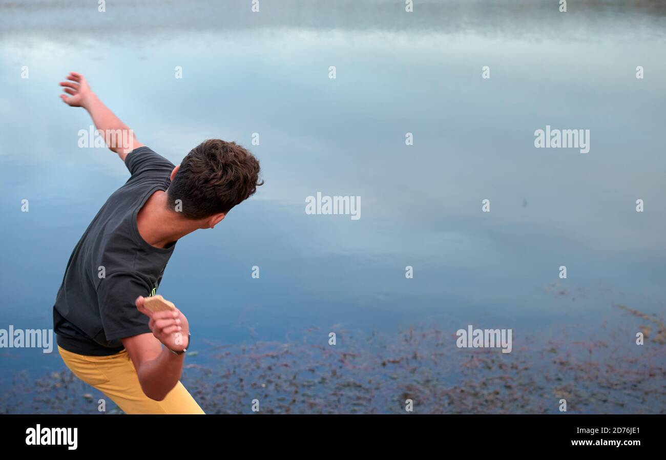 Man throwing stones hi-res stock photography and images - Alamy