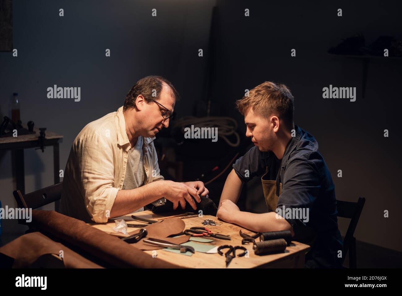 a cute young guy wants to make a gift with his own hands, an ...