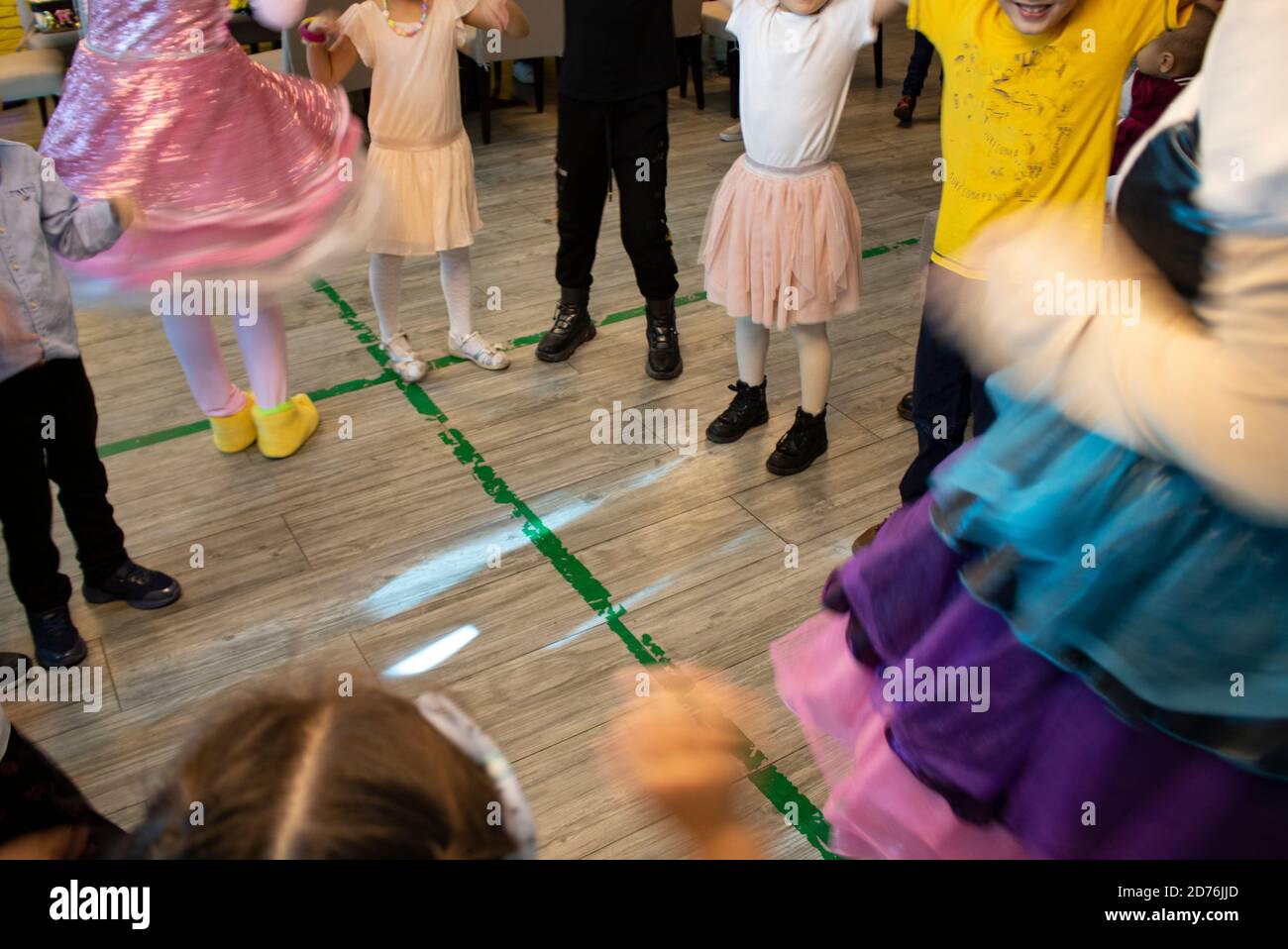Happy children dancing together, blurred Stock Photo - Alamy