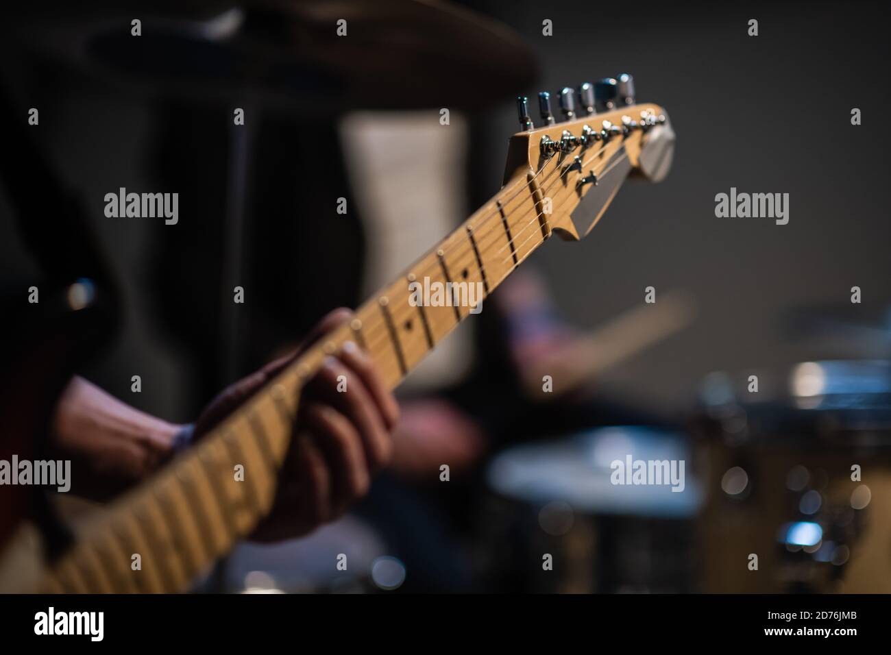 solo and rhythm guitarist and his guitar close up at an underground ...