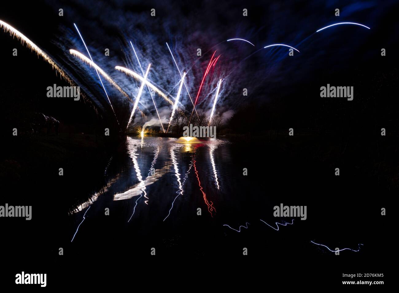 Spectacular and colourful firework display set against a dark Autumn ...