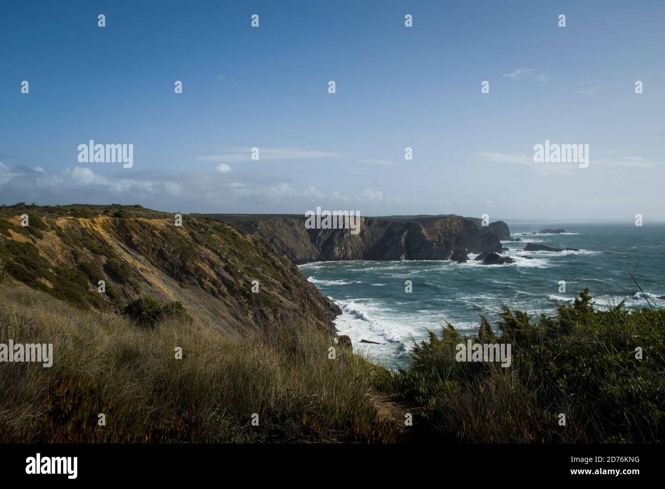 Long coastline landscape with rocky shores, and tall cliffs, entering ...