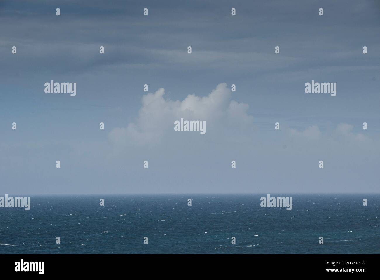 Minimalist landscape of sky over ocean, with horizon line dividing the ...