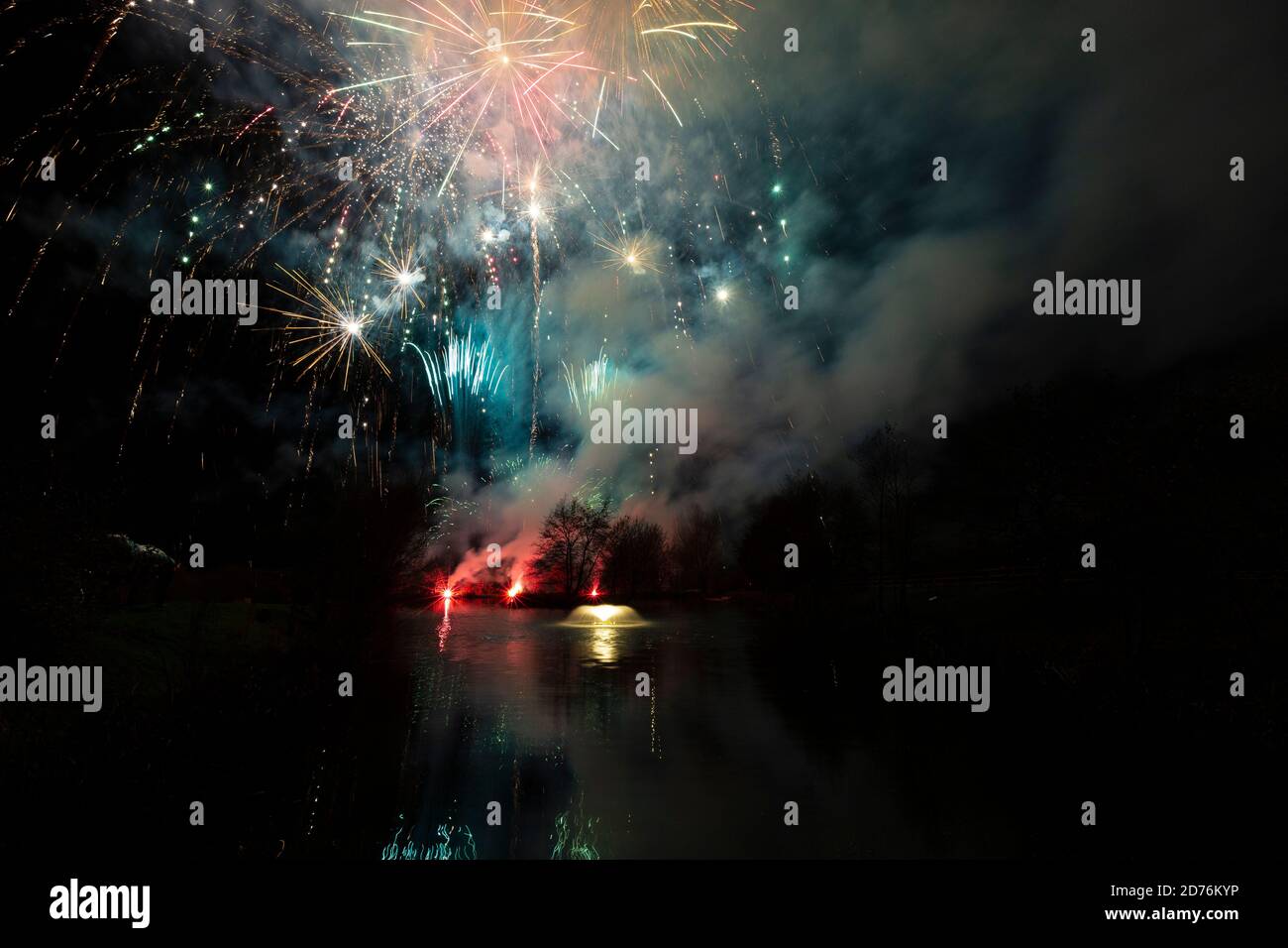 Spectacular and colourful firework display set against a dark Autumn ...