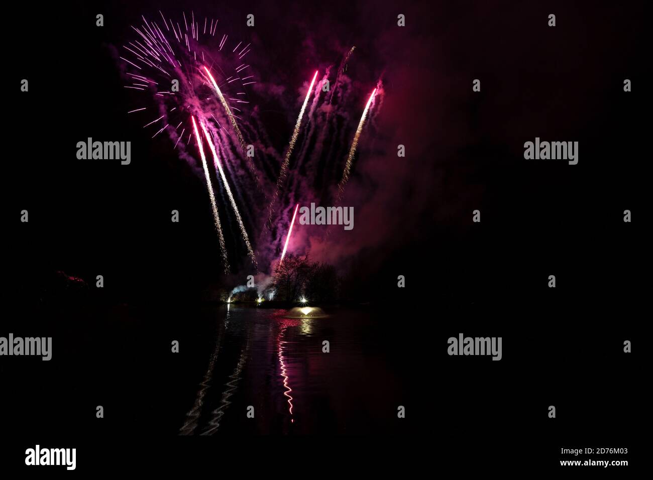 Spectacular and colourful firework display set against a dark Autumn ...