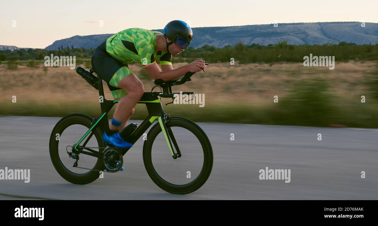 triathlon athlete riding a bike Stock Photo - Alamy