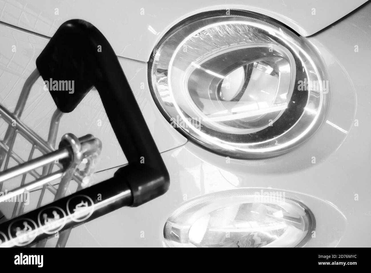 car head light and shopping trolley Stock Photo - Alamy