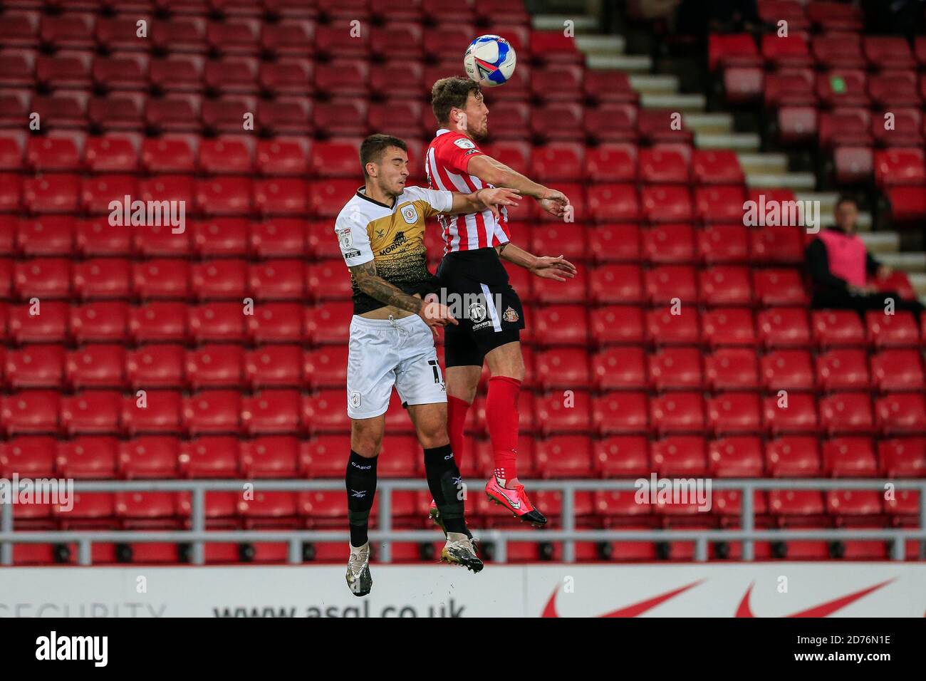 Charlie Wyke (9) of Sunderland in an aerial challenge Luke Offord (17 ...