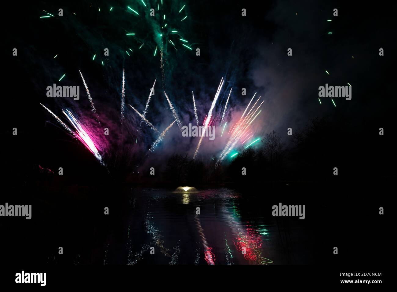 Spectacular and colourful firework display set against a dark Autumn ...