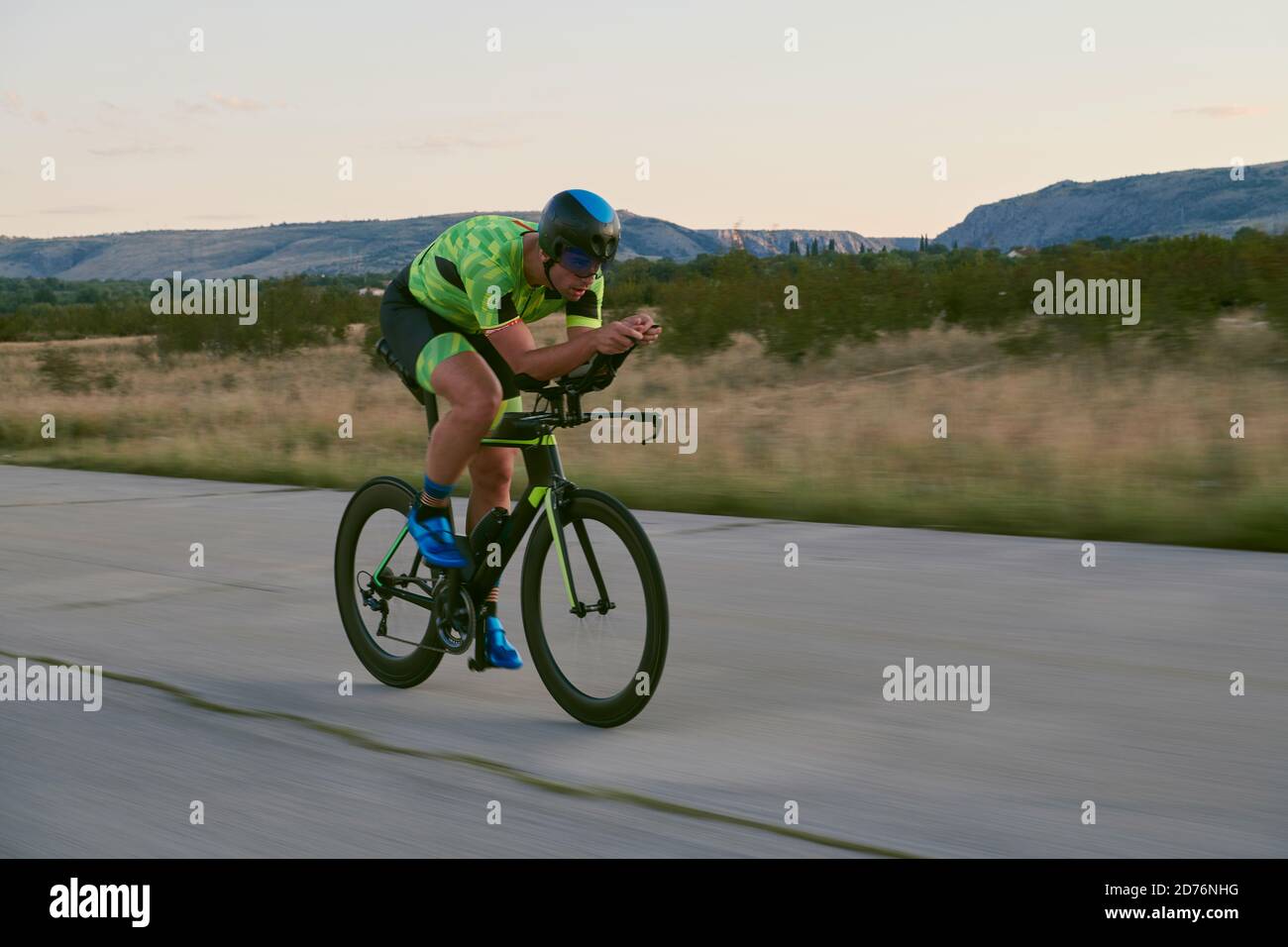 triathlon athlete riding a bike Stock Photo - Alamy