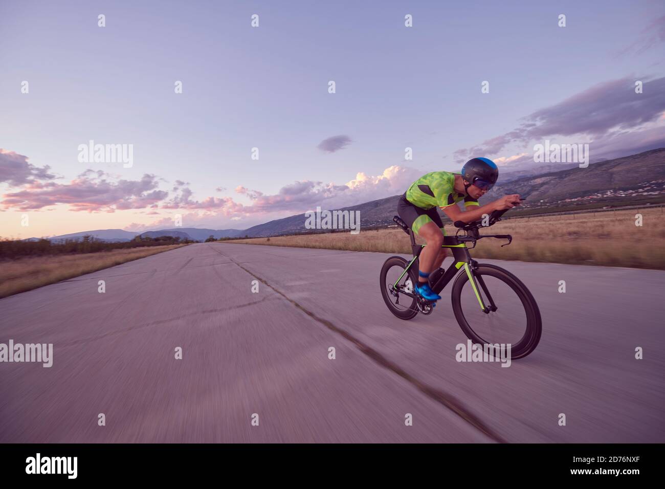 triathlon athlete riding a bike Stock Photo - Alamy