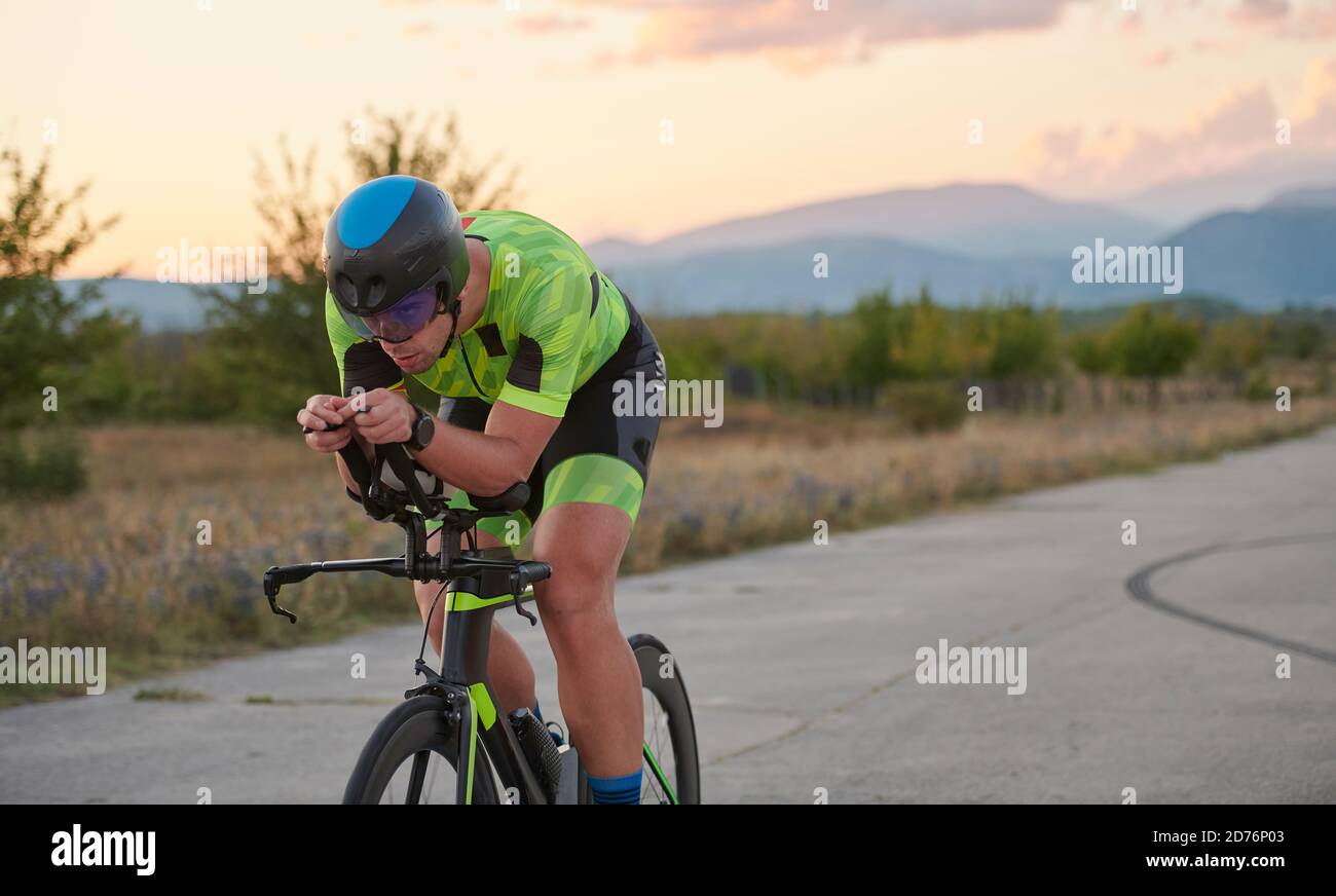 triathlon athlete riding a bike Stock Photo - Alamy