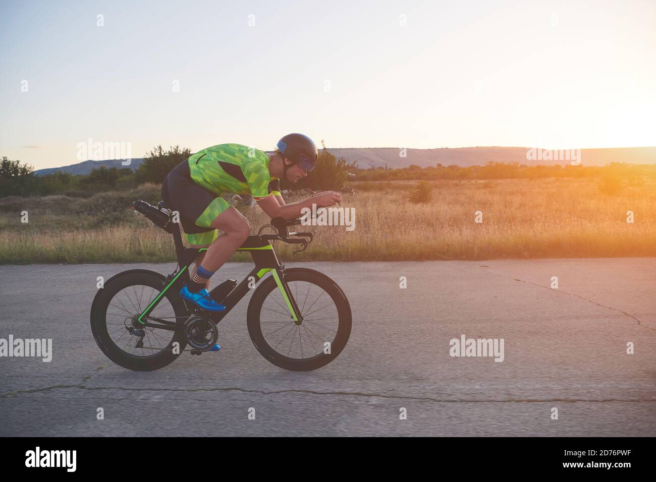triathlon athlete riding a bike Stock Photo - Alamy