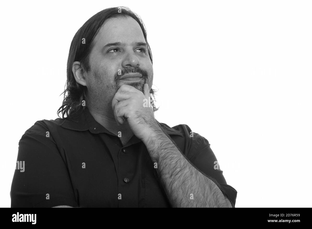 Fat Caucasian man thinking with hand on chin Stock Photo - Alamy