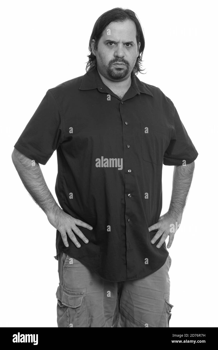 Portrait of stressed overweight bearded man looking angry Stock Photo ...
