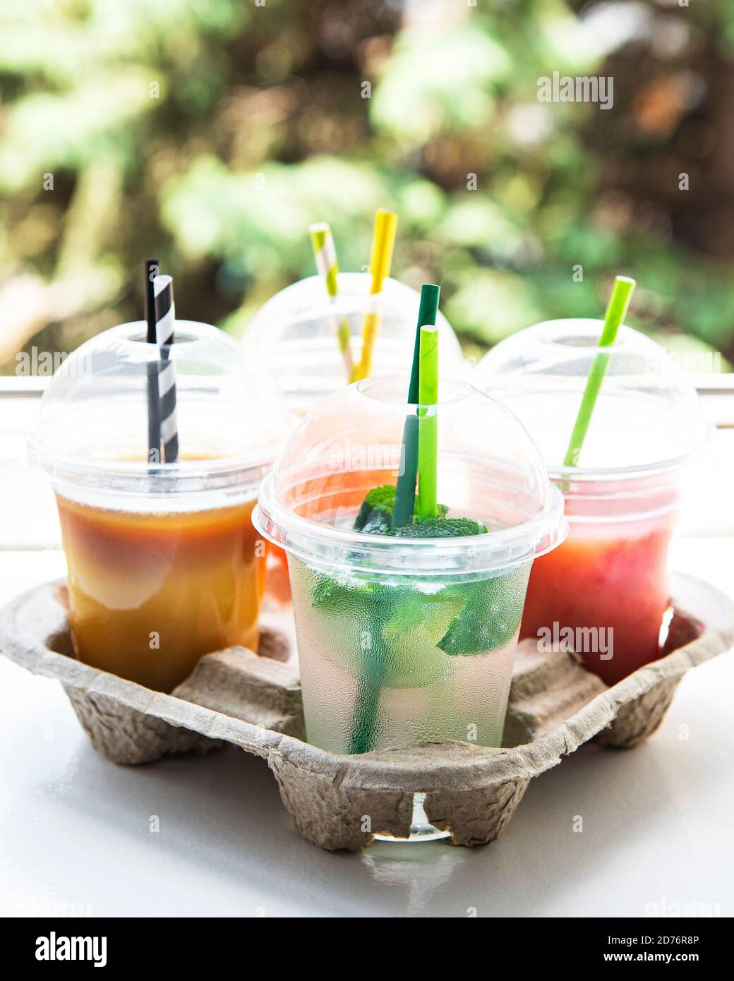 Various summer cold drinks and cocktails in a paper holder Stock Photo ...