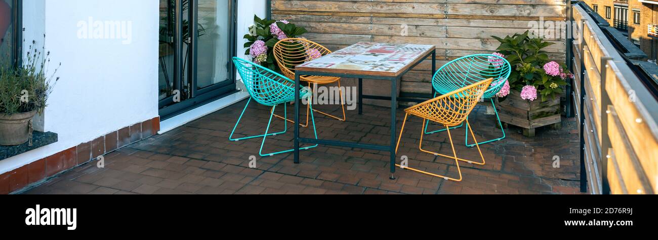 Terrace with table and chairs Stock Photo - Alamy