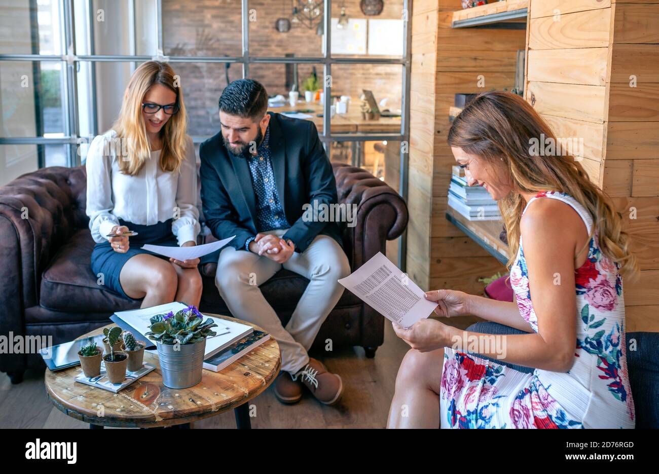 Businesspeople having an informal work meeting Stock Photo - Alamy