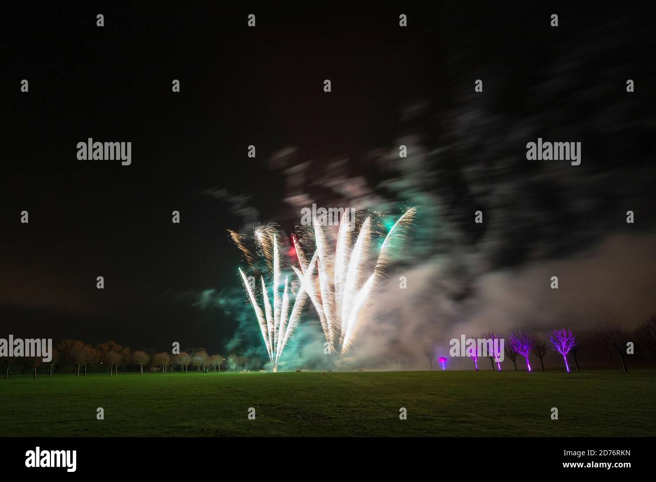 Spectacular and colourful firework display set against a dark Autumn ...