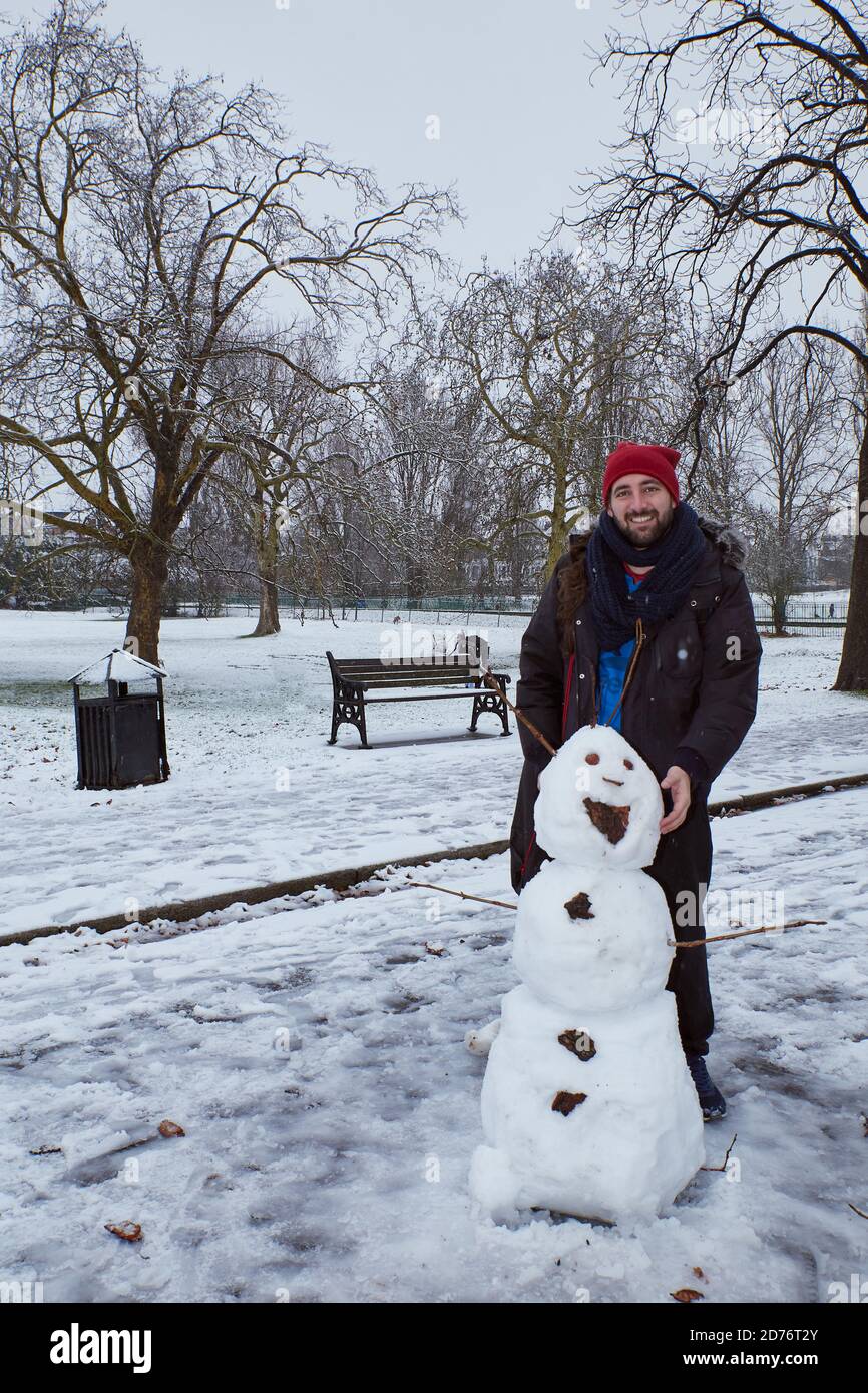 photography of man with snowman Stock Photo - Alamy
