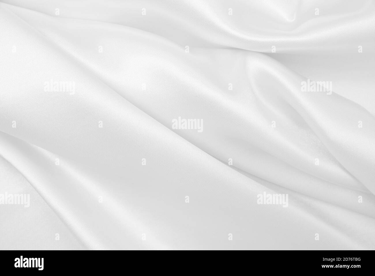 Smooth elegant white silk or satin luxury cloth texture can use as ...
