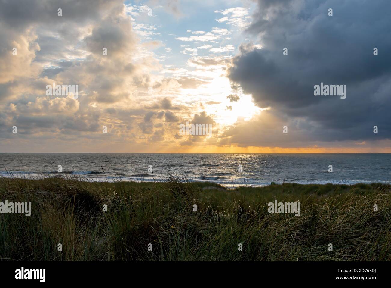 Reflection of the setting sun on the north sea hi-res stock photography ...